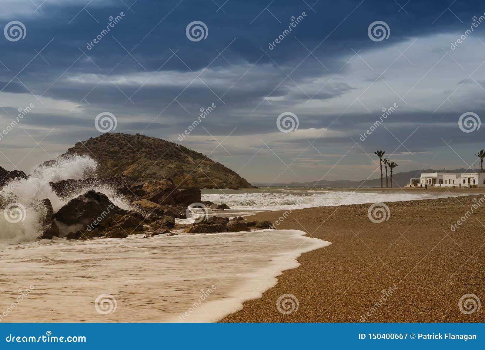 A Spanish Beach with Crashing Waves and Palm Trees Stock Image - Image ...