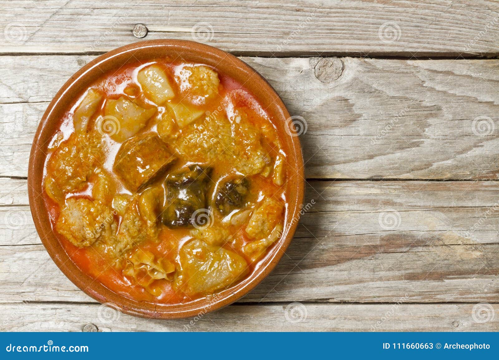Spanish Callos in an Earthenware Dish on a Wooden Table Stock Image ...