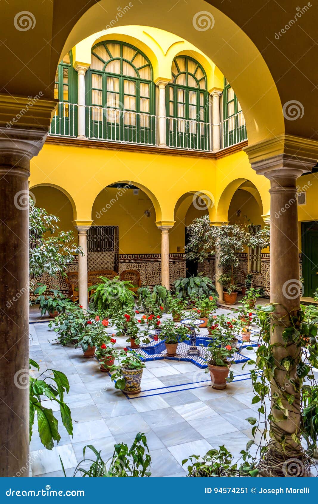 Spanish courtyard stock image. Image of yellow, vines - 94574251