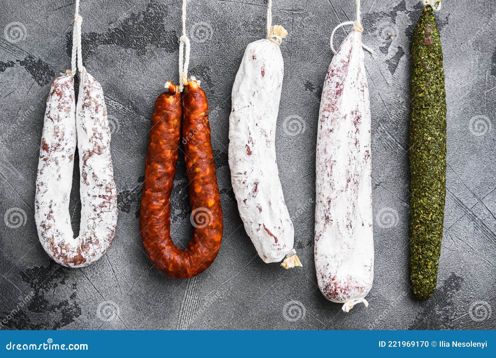 Spanish Dry Salami from a Rack at Market on Grey Background Stock Photo ...