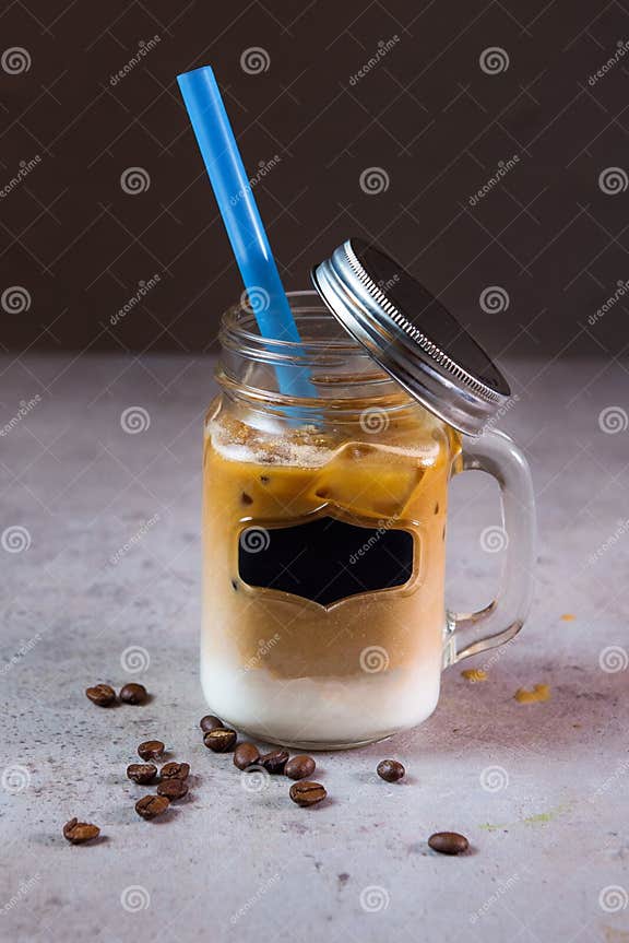 Spanish Latte Serving in Jar with Straw Side View on Background Stock ...