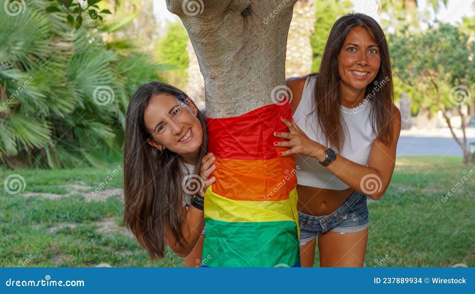Spanish Lesbian Couple Posing with a Pride Flag Stock Photo - Image of ...