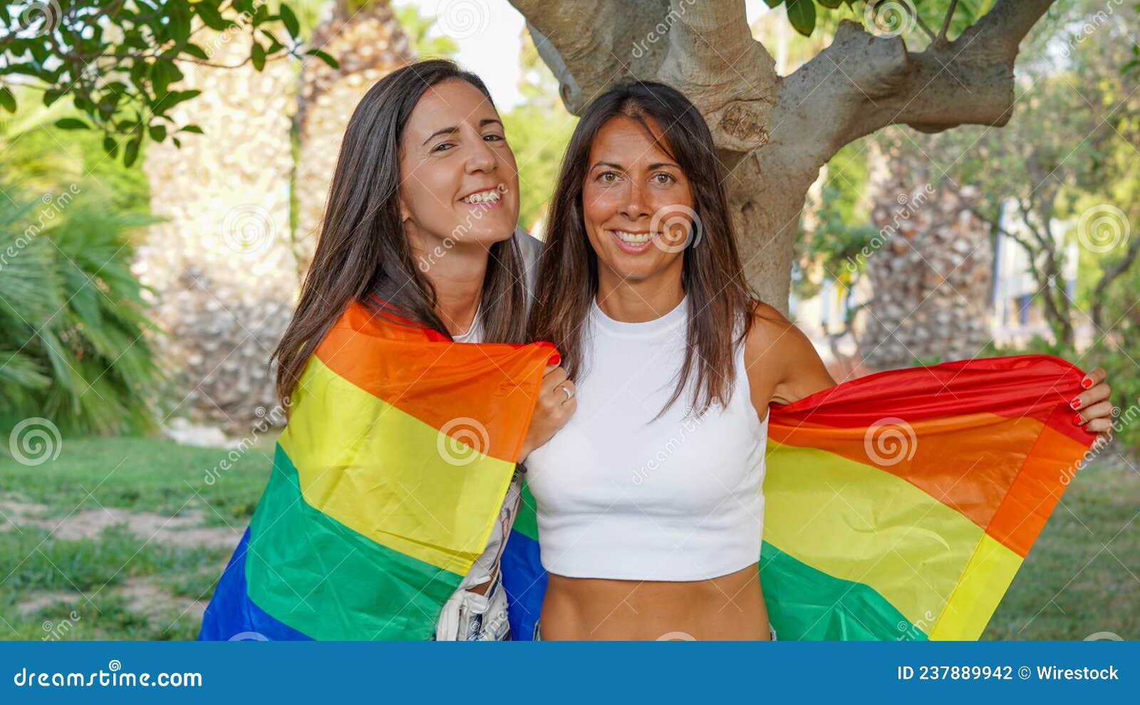 Spanish Lesbian Couple Posing with a Pride Flag Stock Photo - Image of ...