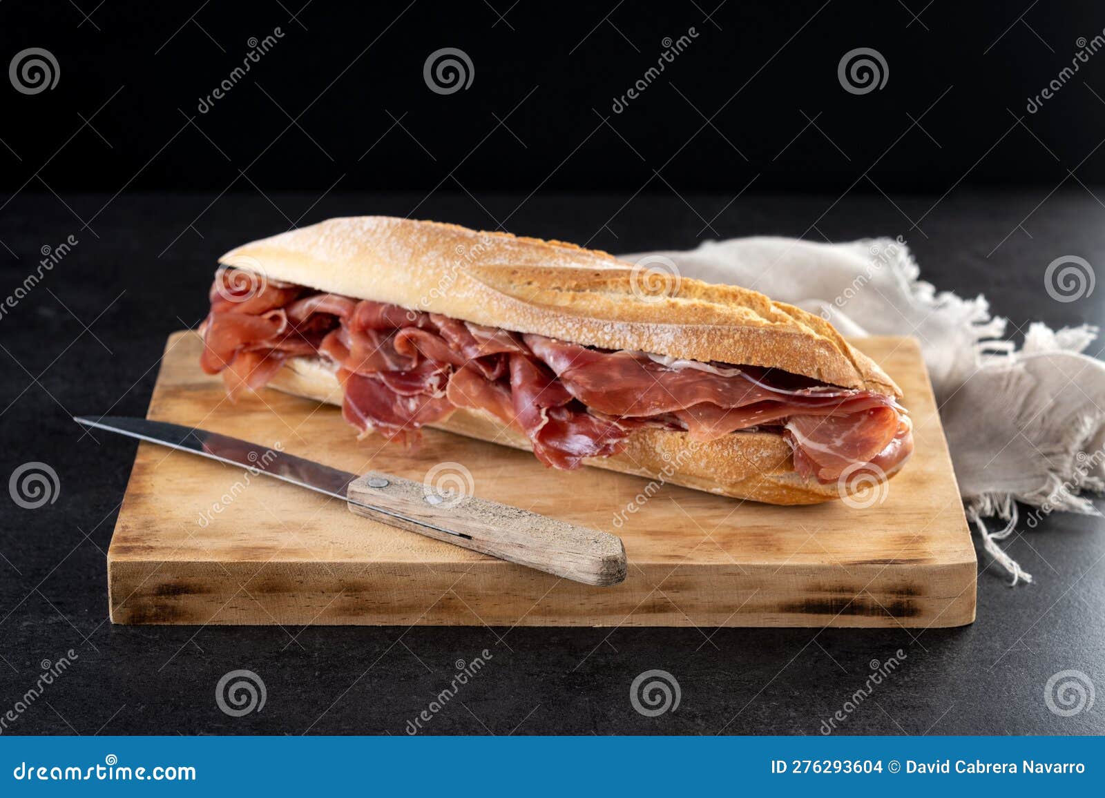 Spanish Serrano Ham Sandwich on Black Slate Background Stock Photo ...