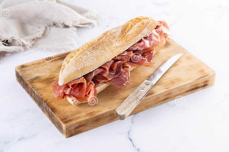 Spanish Serrano Ham Sandwich on White Marble Background Stock Image ...