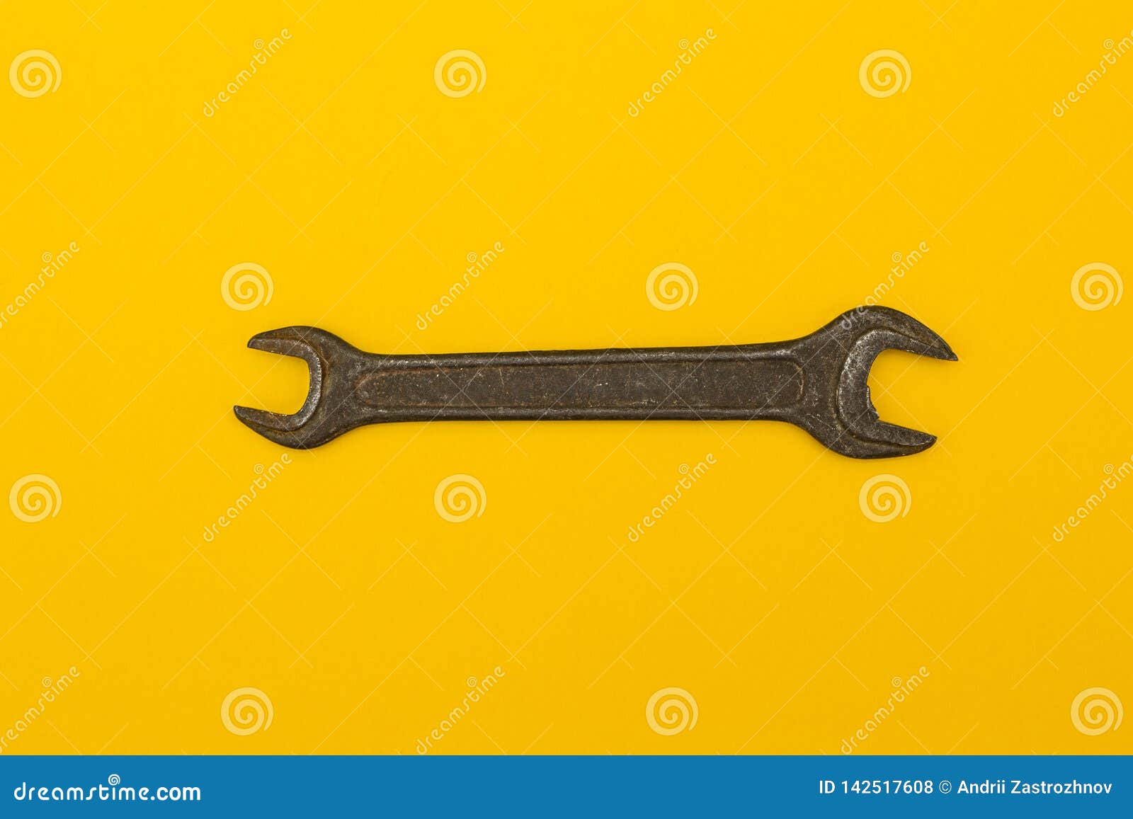Spanner on a Yellow Background Stock Photo - Image of fitter ...