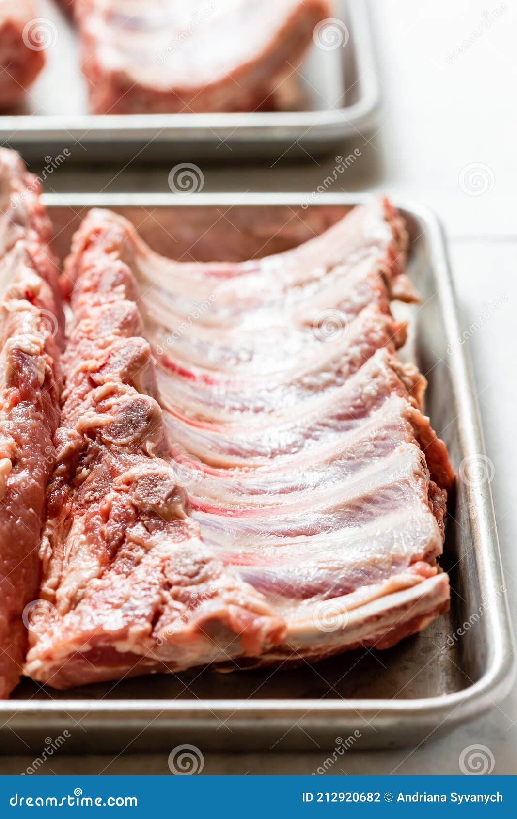 Spare Ribs Uncooked on Stainless Steel Platter Stock Photo - Image of ...