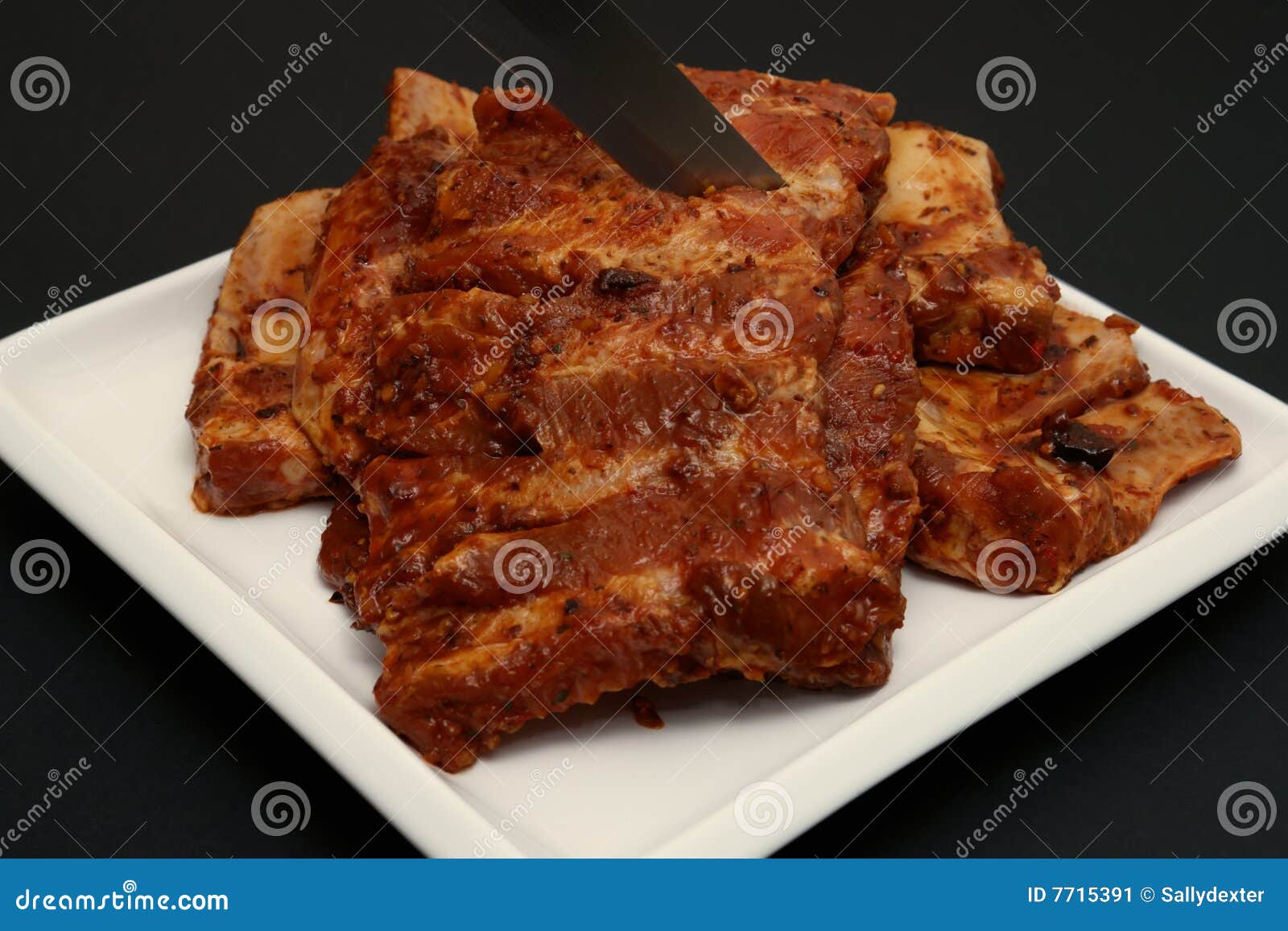 Spare ribs on white plate stock image. Image of baked - 7715391