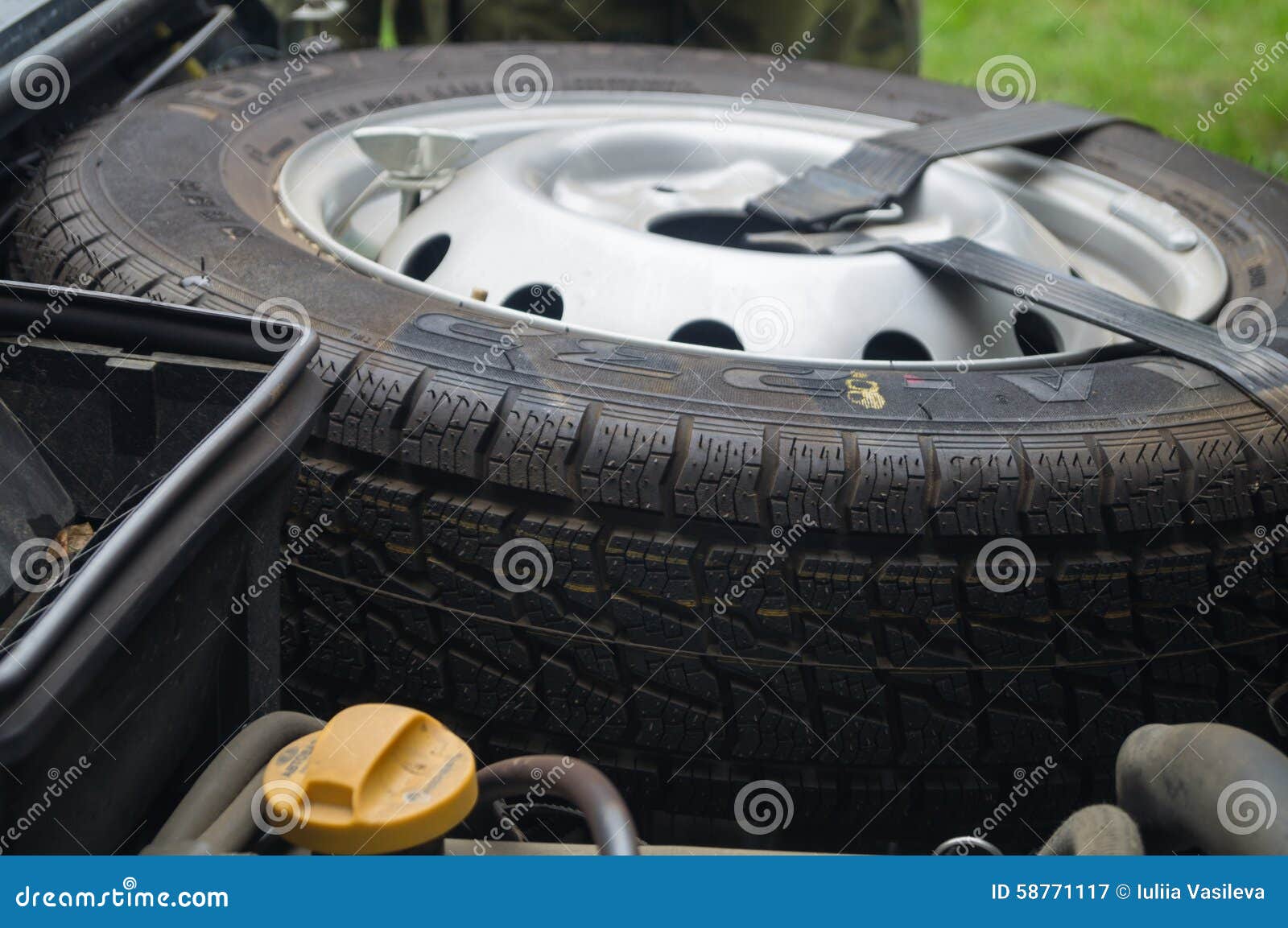 Spare tire under the hood stock image. Image of inside - 58771117
