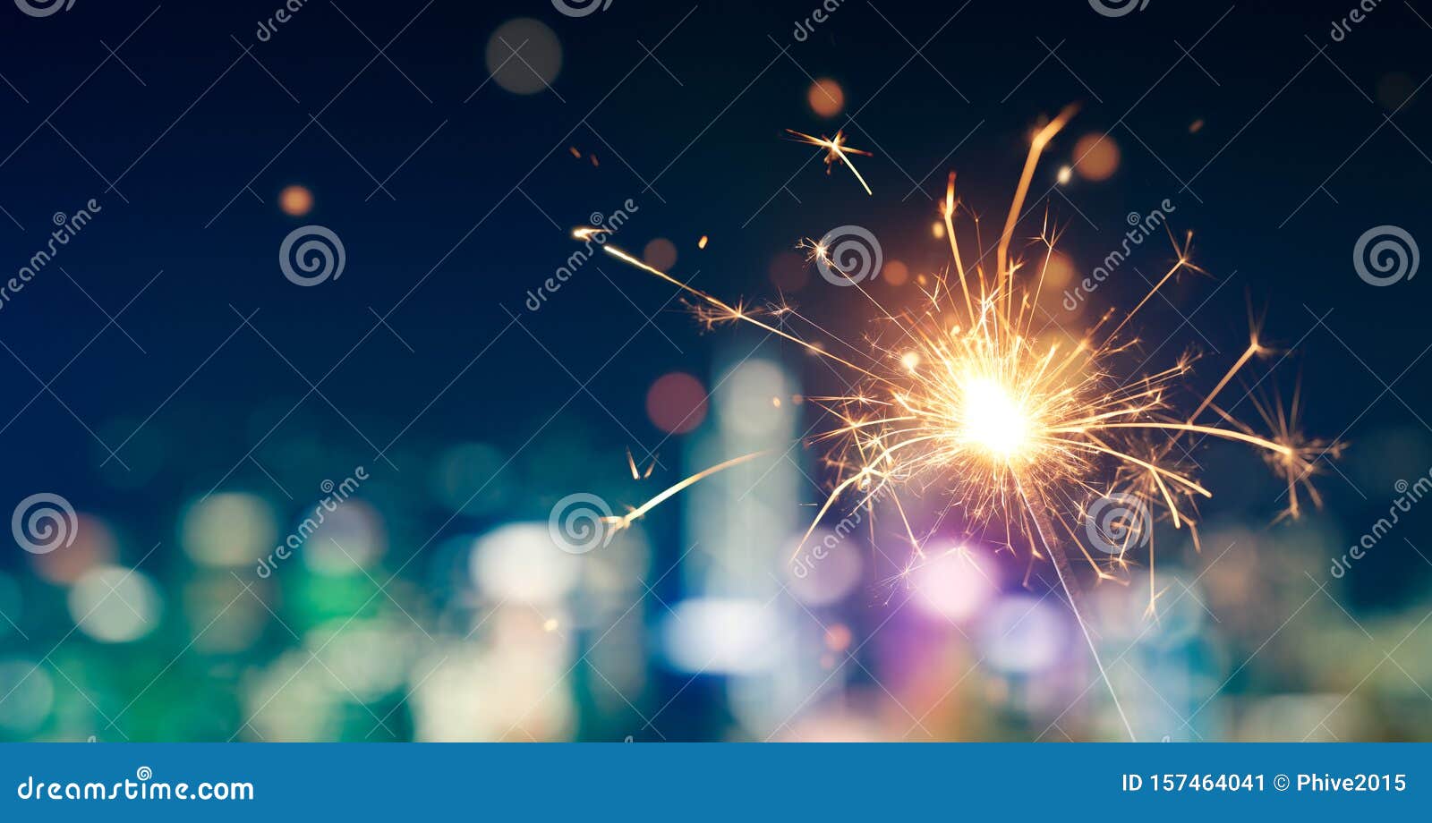 Sparkler with Blurred City Light Background Stock Image - Image of ...