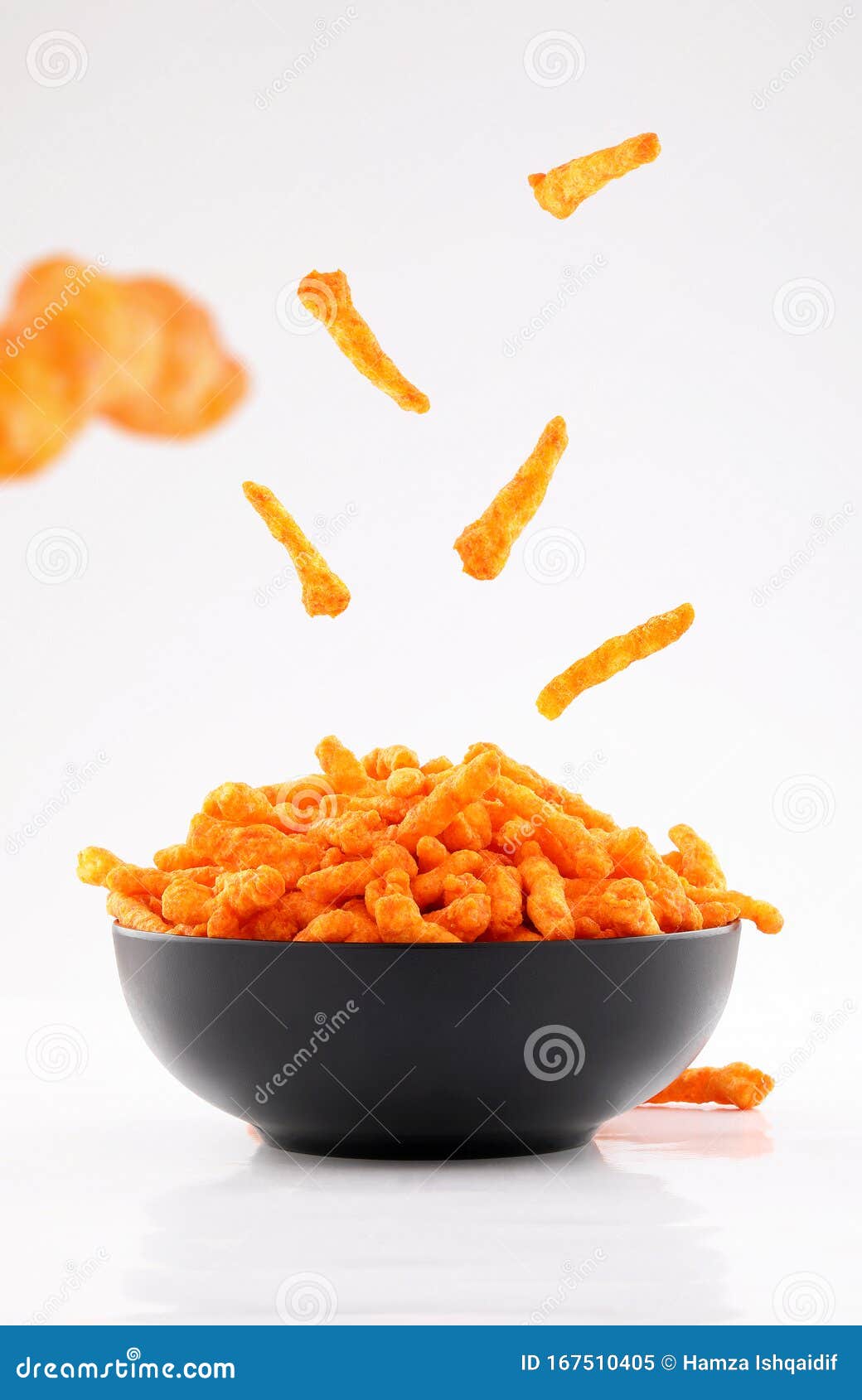 Crunchy Stick Corn Chips in Black Bowl on White Background Stock Image ...