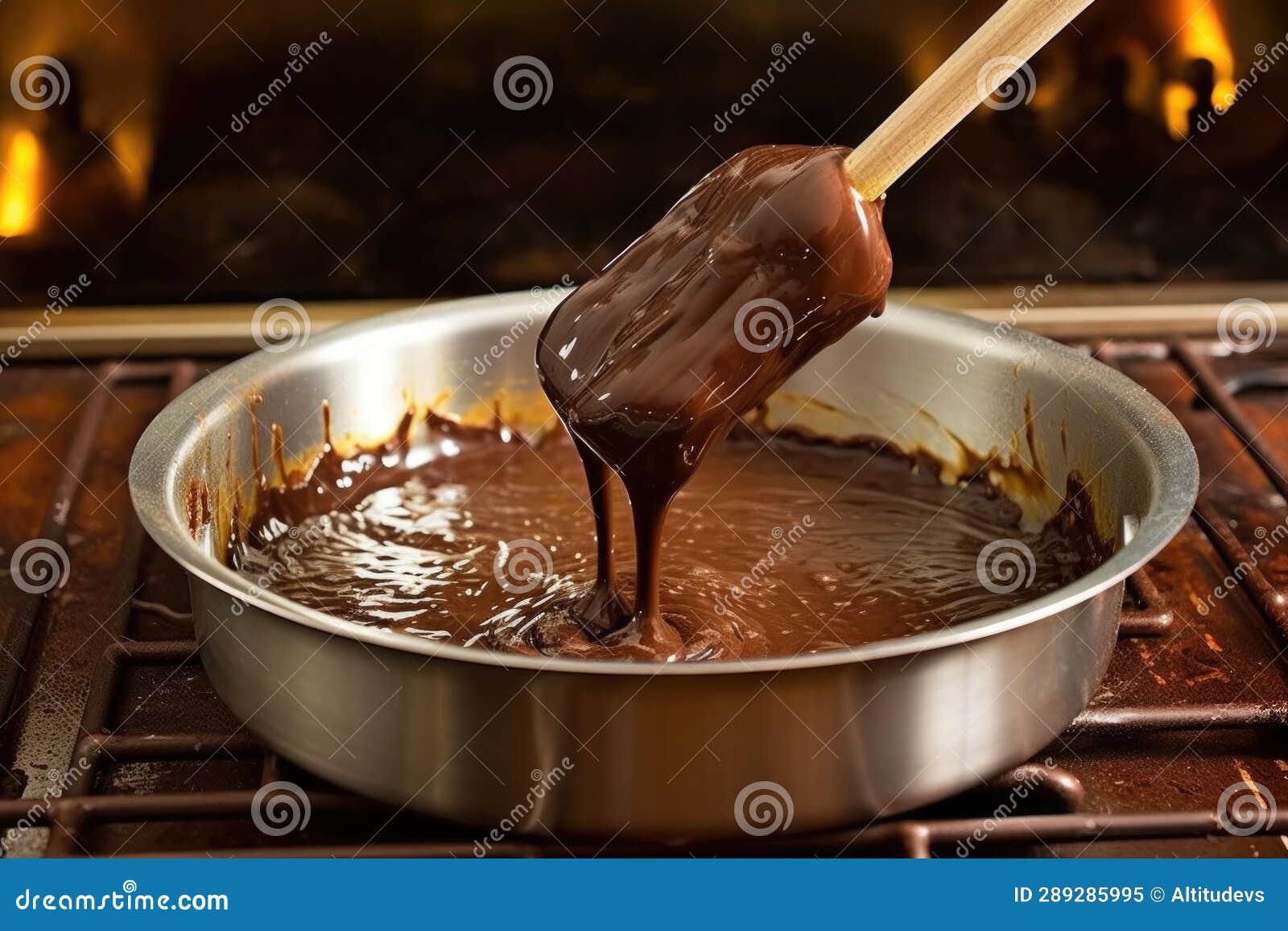 A Spatula Stirring Melted Chocolate for the Tempering Process Stock ...