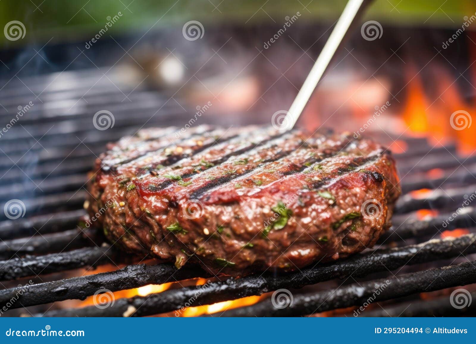 Spatula Under Uncooked Burger Patty on Grill Stock Photo - Image of ...