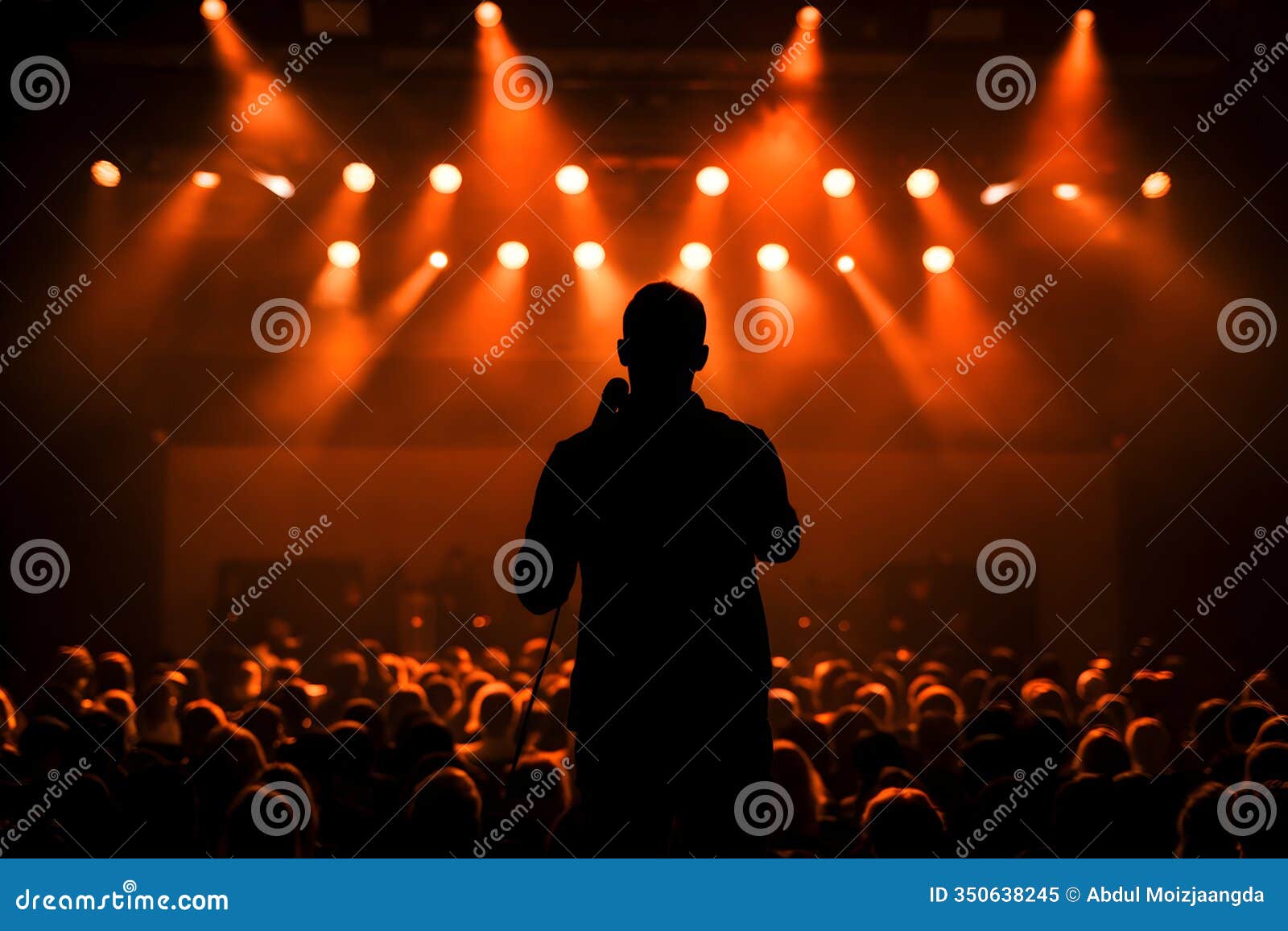 Speaker Addressing Audience, Warm Lighting Creating Dramatic Stage ...