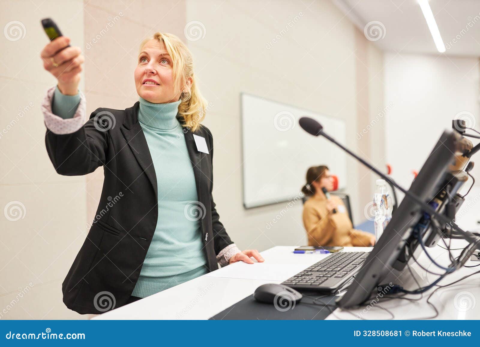 Speaker Using Remote Control while Giving Presentation in Auditorium ...
