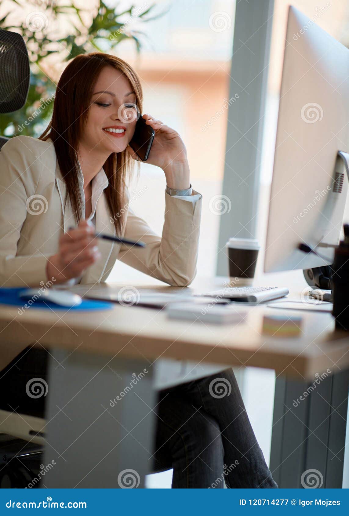 Speaking To Client on the Phone - Female Working in a Design Stu Stock ...