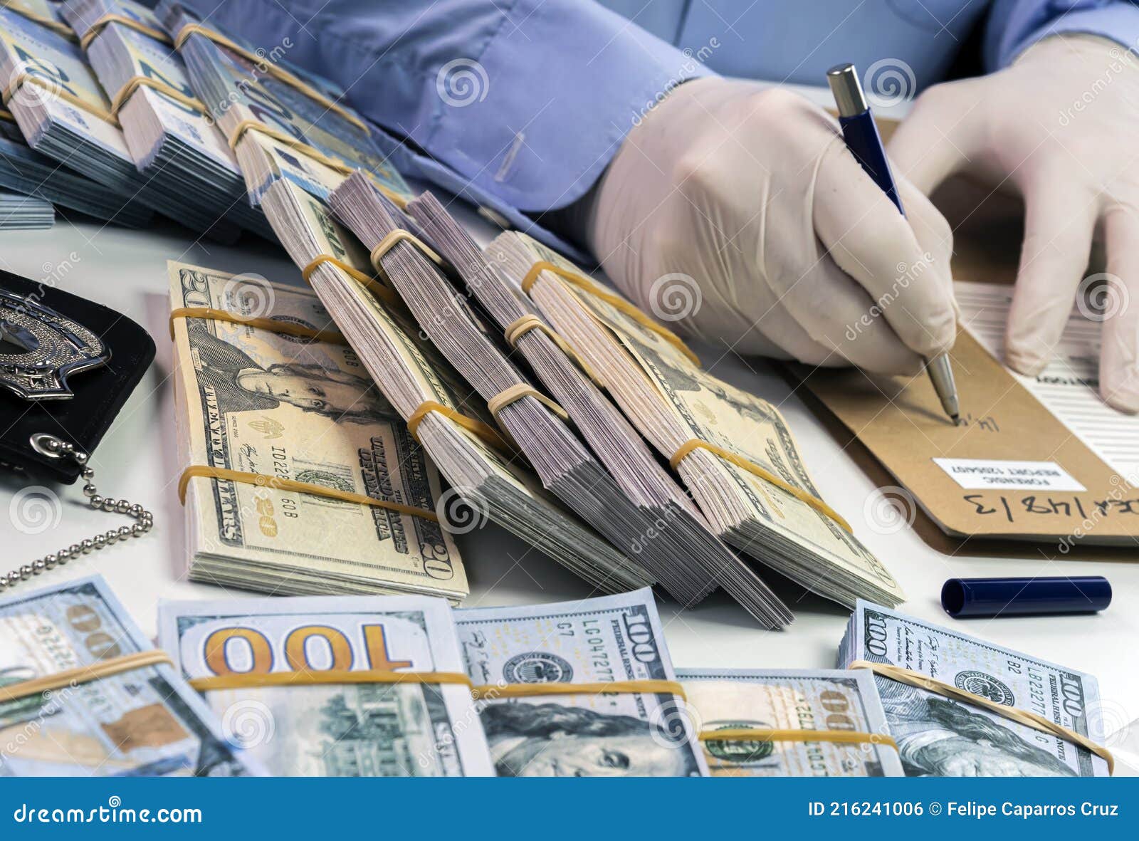 Specialised Police Officer Notes Dollar Banknote Reference of a Robbery ...