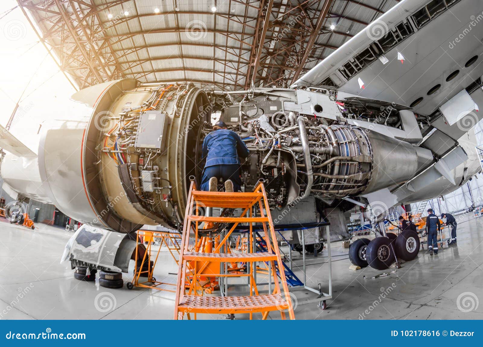 Specialist Mechanic Repairs the Maintenance of a Large Engine of a ... Specialist Mechanic Repairs the Maintenance of a Large Engine of a ...