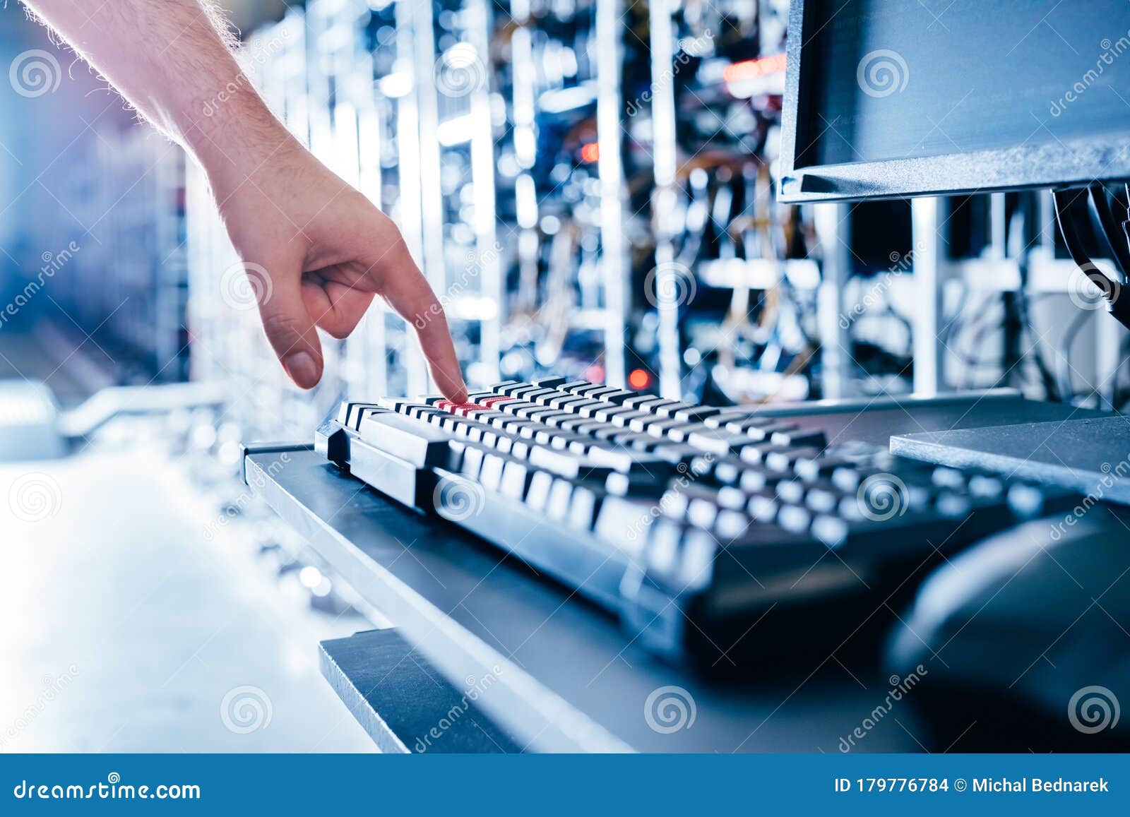 It Specialist Pressing Red Button on Keyboard in Big Data Center Stock ...