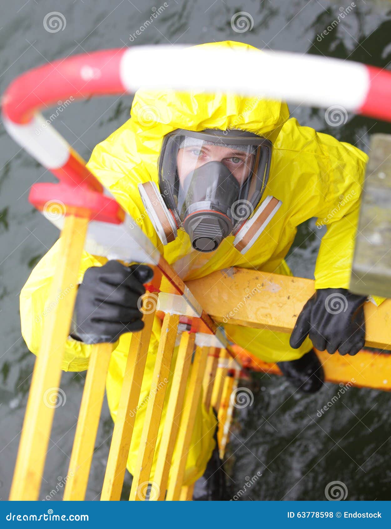 A Man In A Protective Suit And Mask Holds In His Hands A Flask With A ...