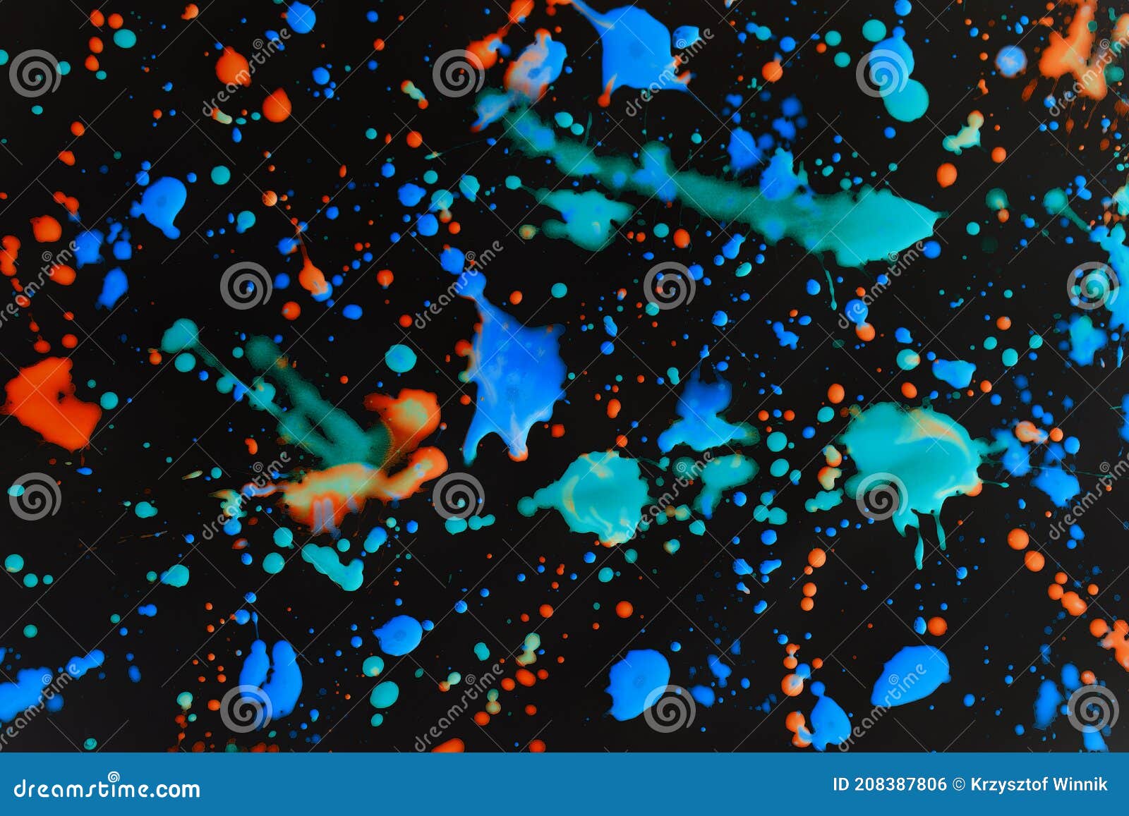 Speckled Paint of Different Colors on a Black Background Stock Photo ...