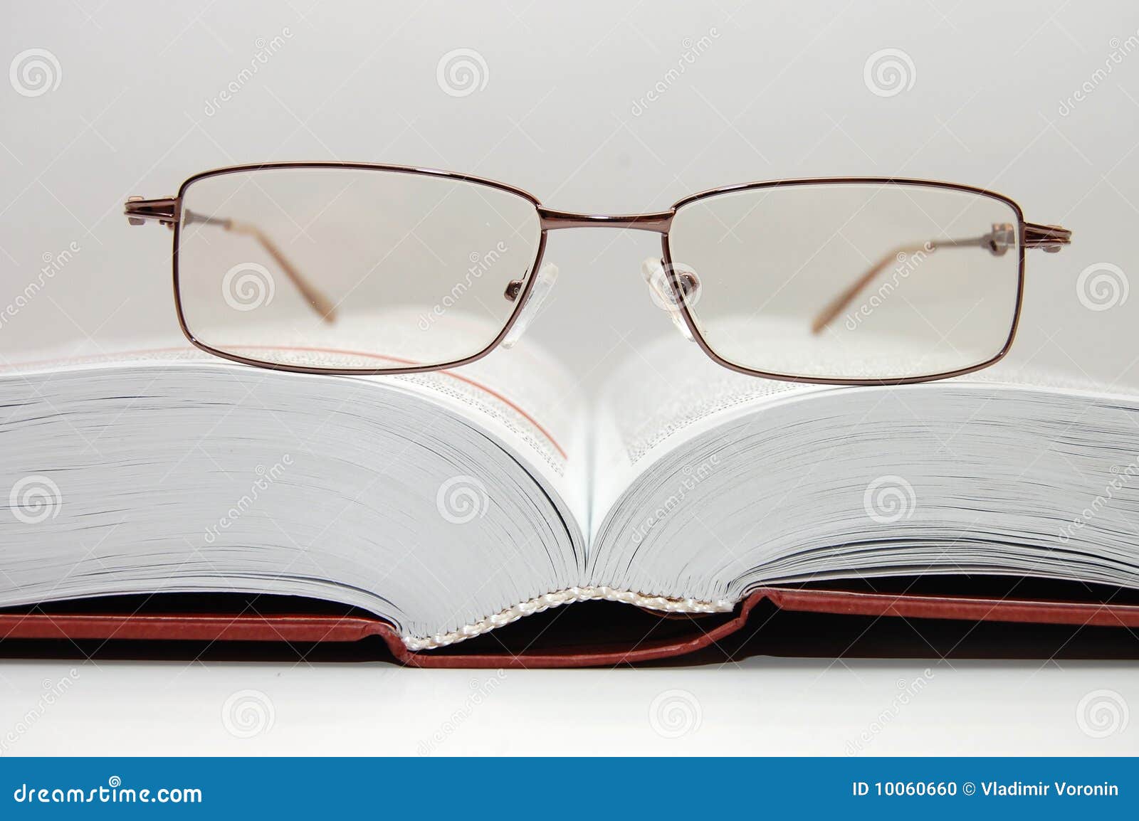 Spectacles Laying on the Open Book Stock Photo - Image of highschool ...