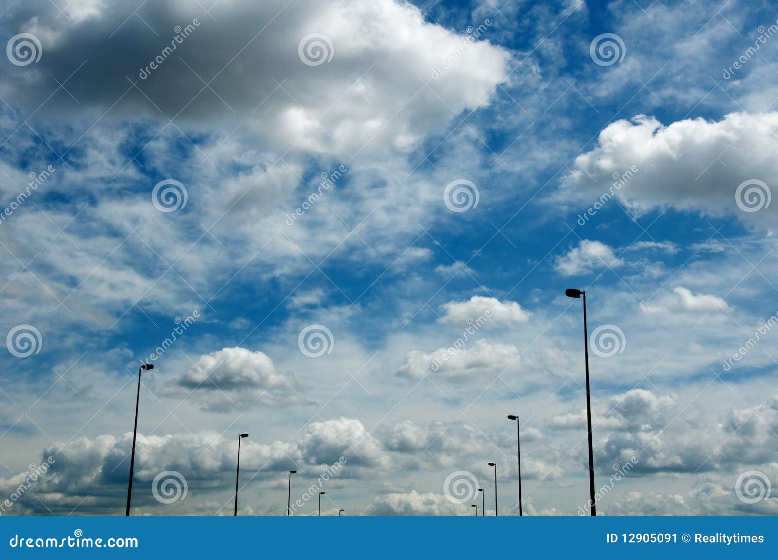 Spectacular Clouds & Receding Light Poles Stock Image - Image of blue ...