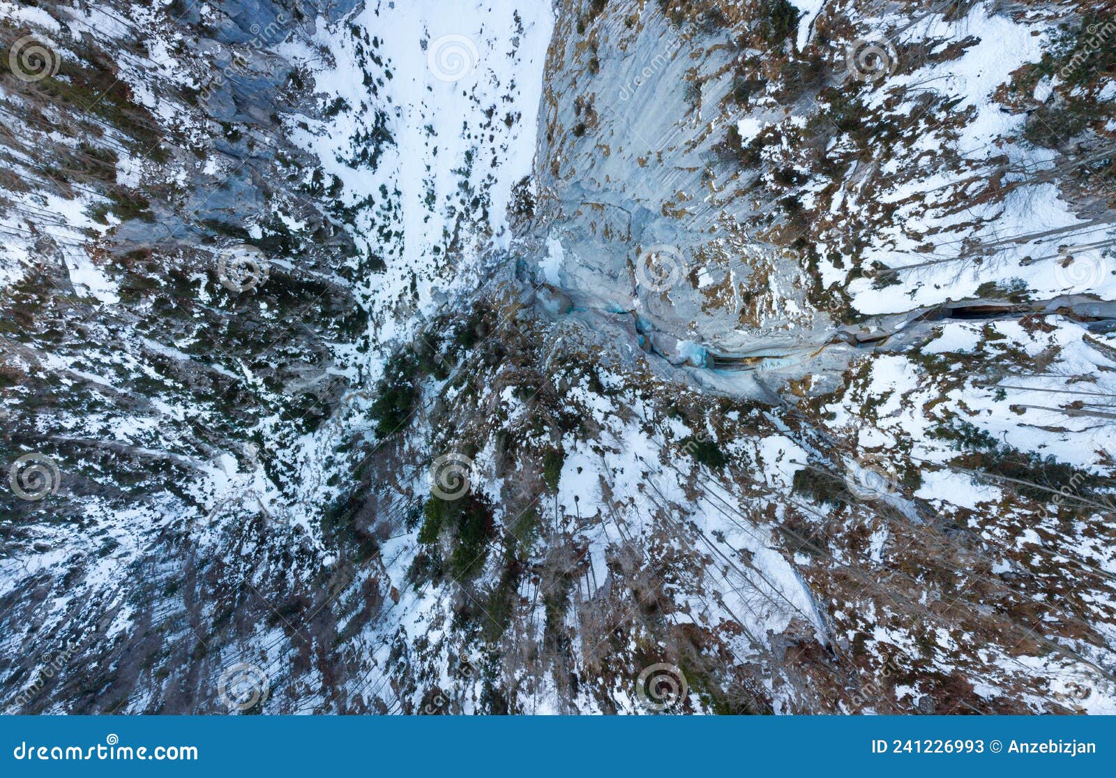 Spectacular Drop Down View of Waterfall Falling Over Rocky Forest Ledge ...