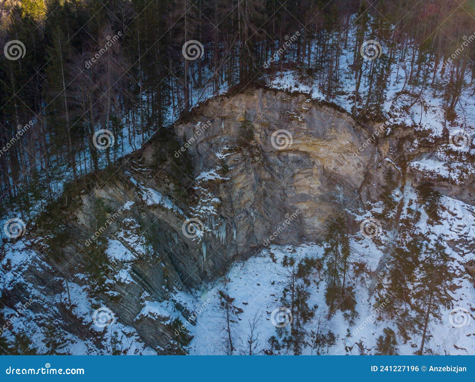 Spectacular Drop Down View of Waterfall Falling Over Rocky Forest Ledge ...