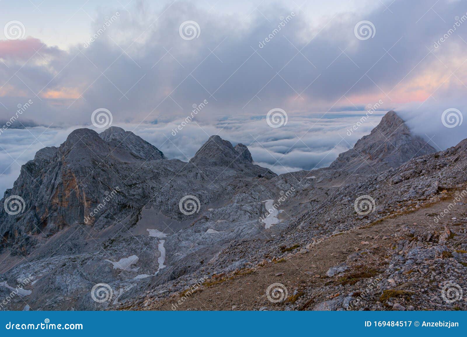 Spectacular Mountain View with Evening Clouds Rolling Over Peaks and ...
