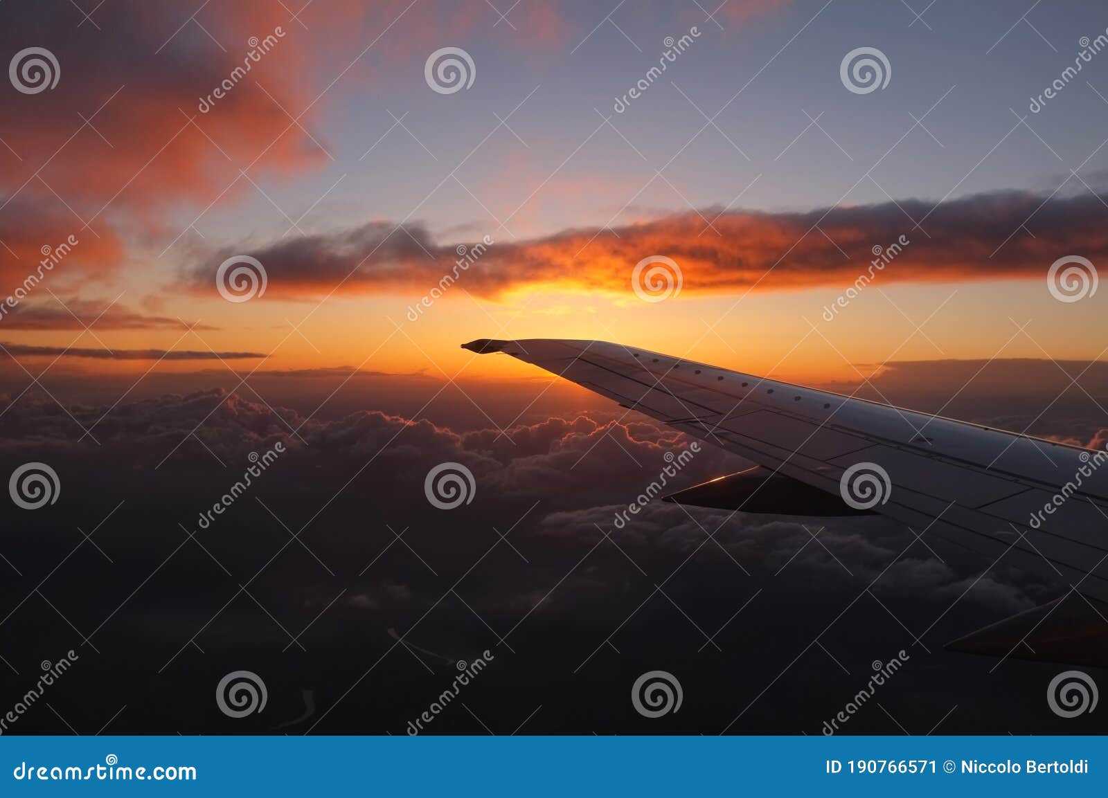 Spectacular Sunset from Inside an Airplane Over Clouds Stock Image ...