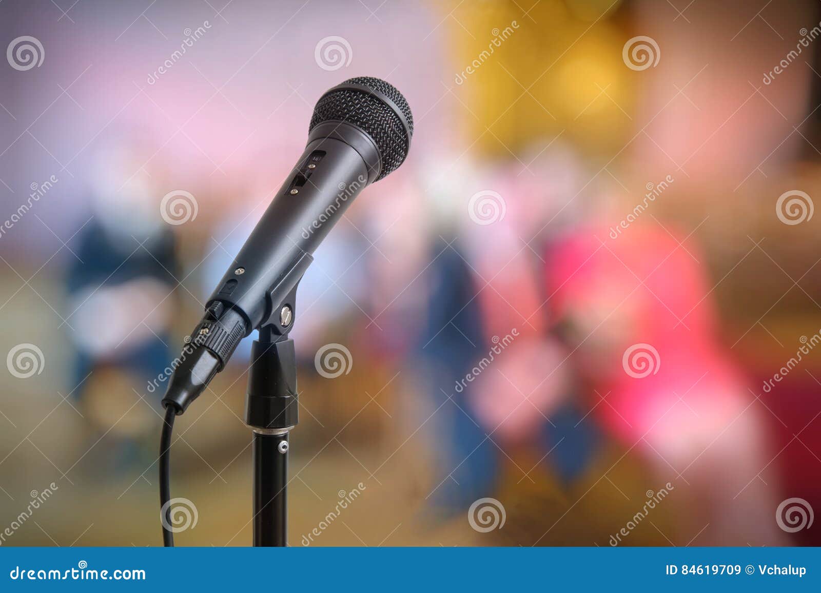 Speech or Conference Concept. Microphone on Stand in Front of Audience ...