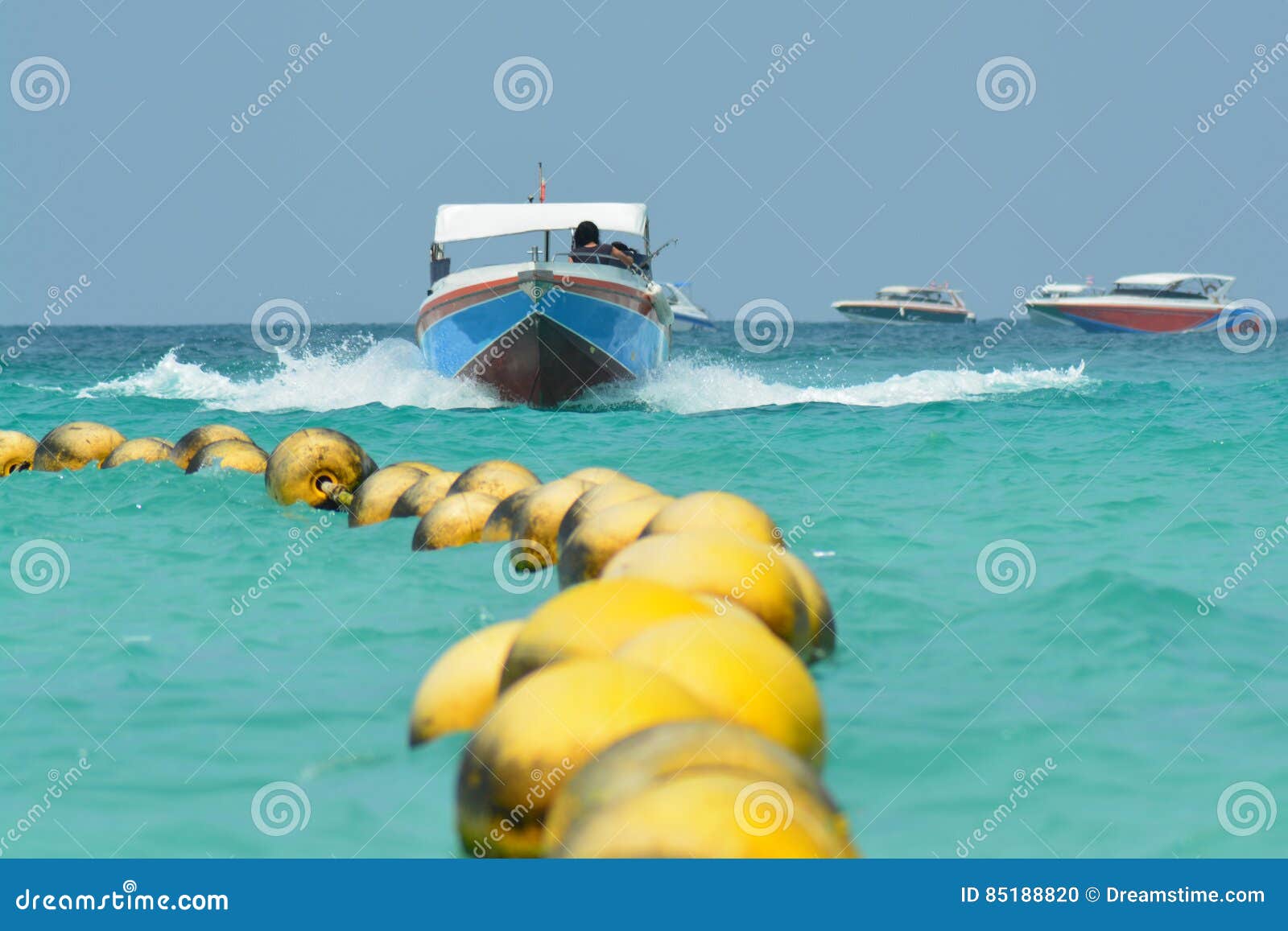 Speed boat and buoys stock photo. Image of beach, boat - 85188820