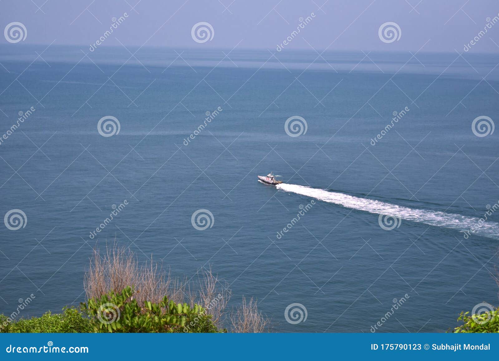 A Speed Boat Moving Forward Leaving a White Trail Behind, Far in the ...