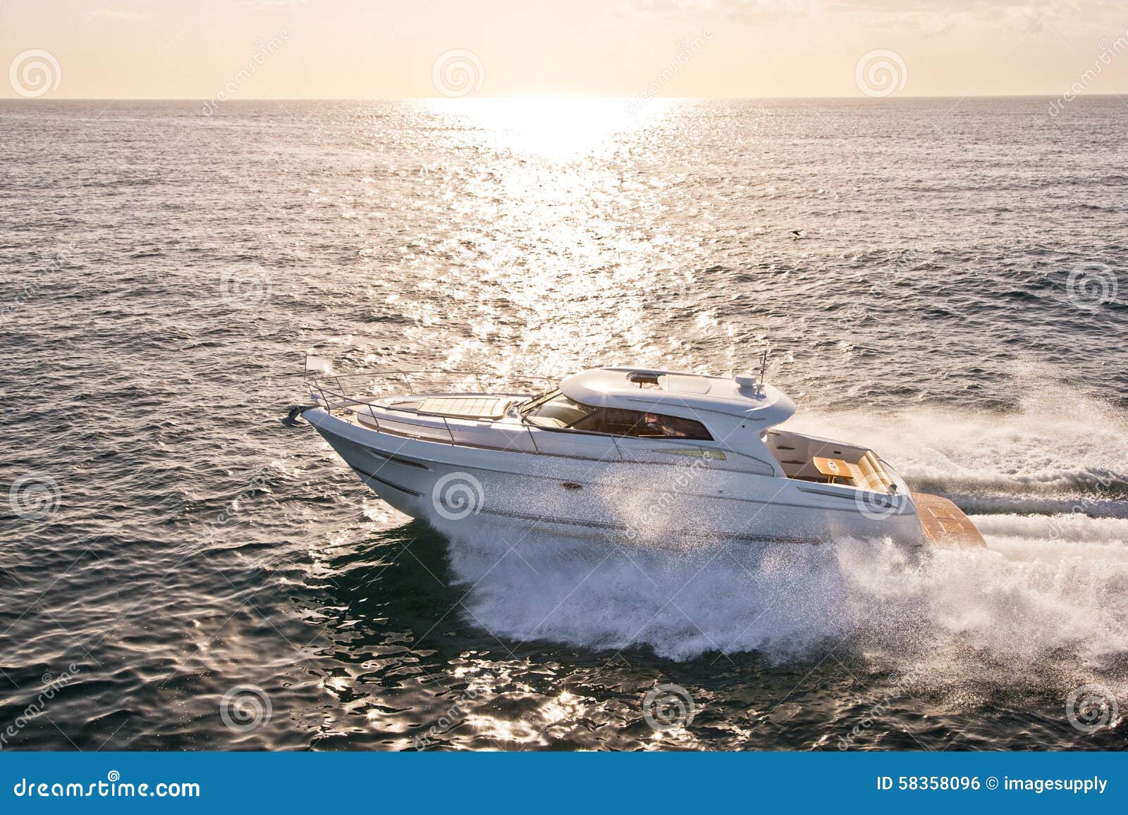 Speed Boat in the Ocean with Sun Setting Behind Stock Photo - Image of ...
