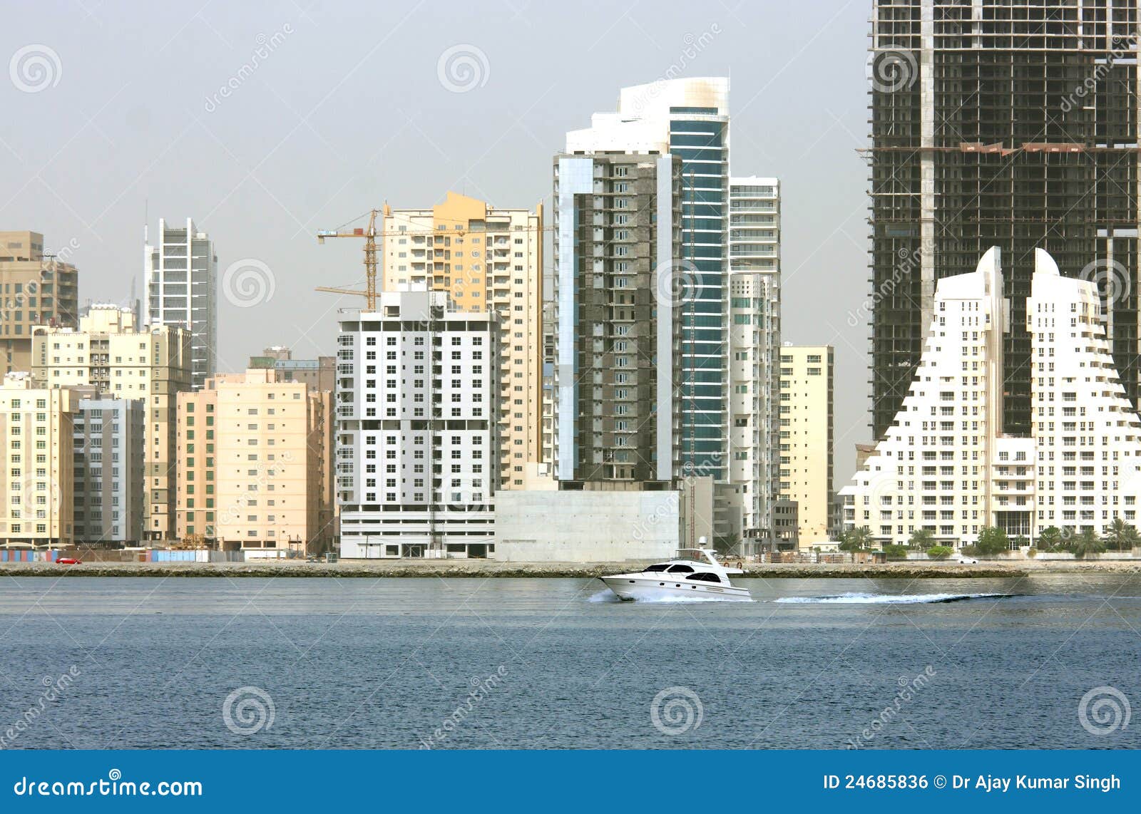 A Speedboat Speeding & Highrise Building, Bahrain Stock Photo - Image ...