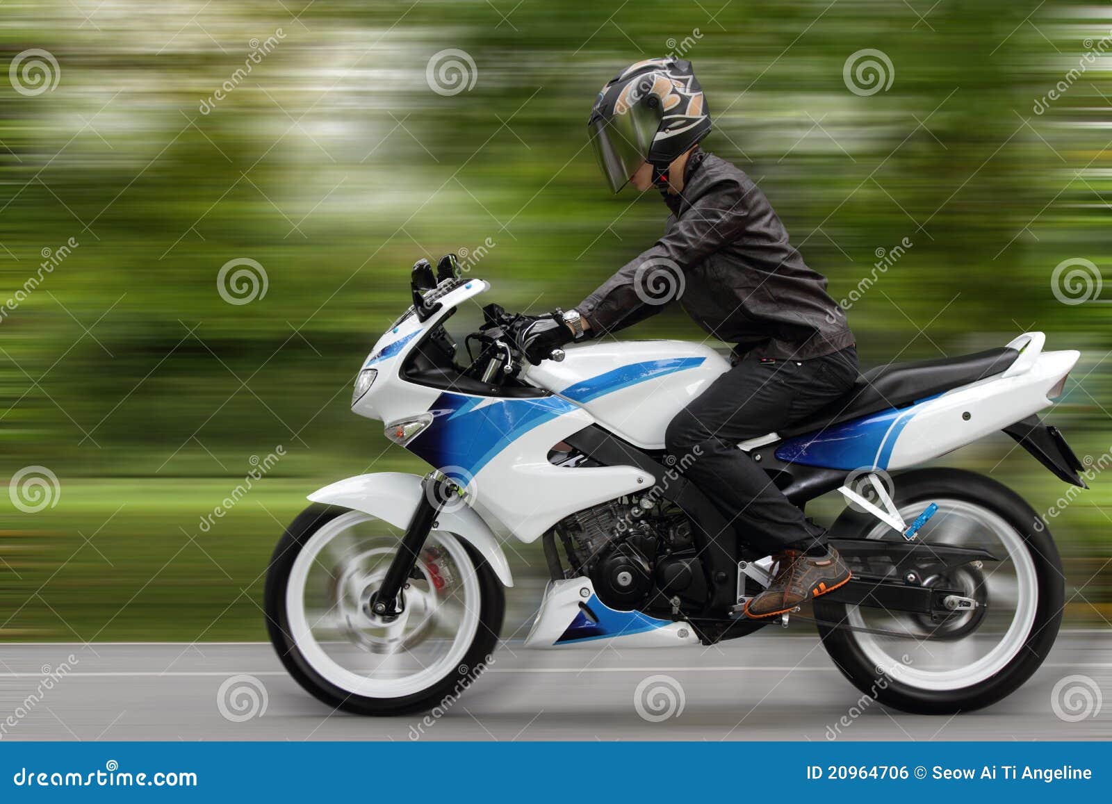 Speeding Motorcyclist stock photo. Image of view, riding - 20964706