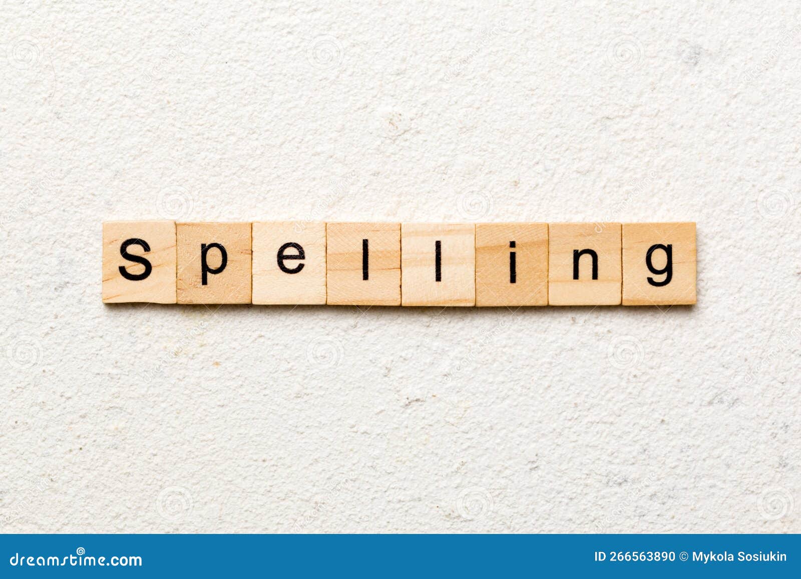 Spelling Word Written on Wood Block. Spelling Text on Cement Table for ...