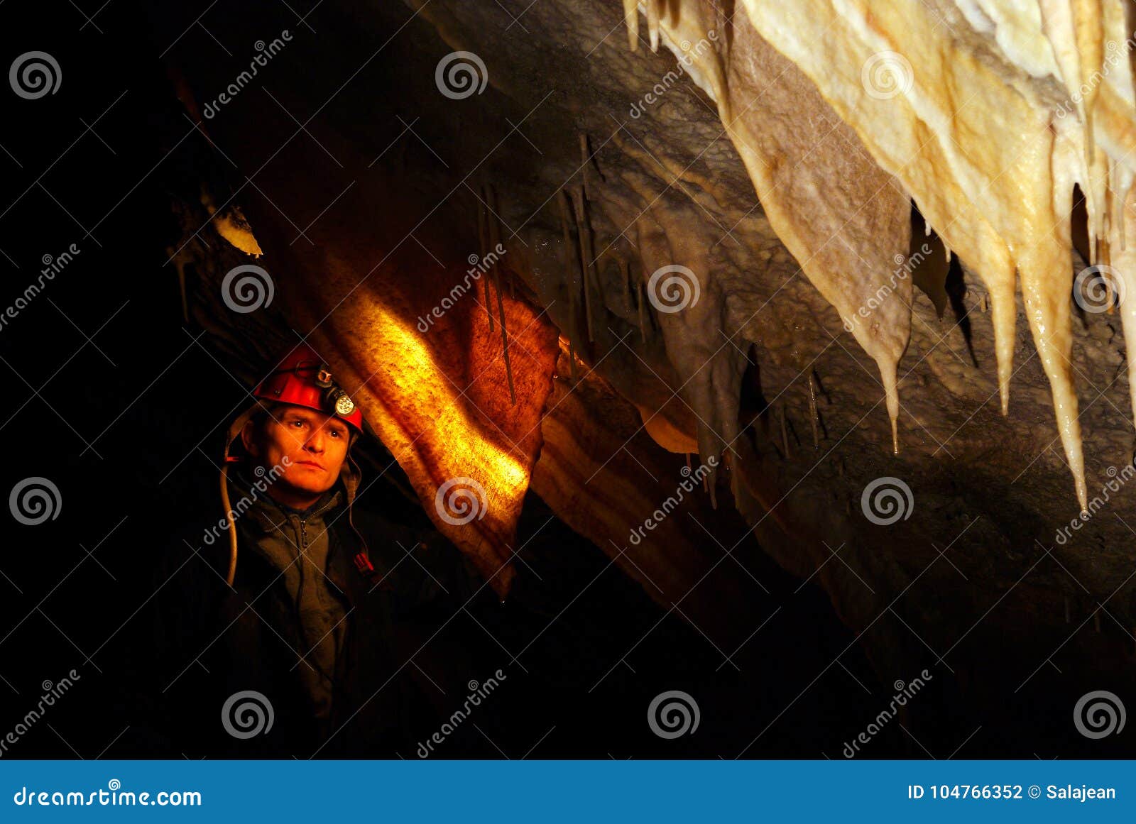 Spelunker Admiring Stalactites in a Cave Stock Photo - Image of dark ...