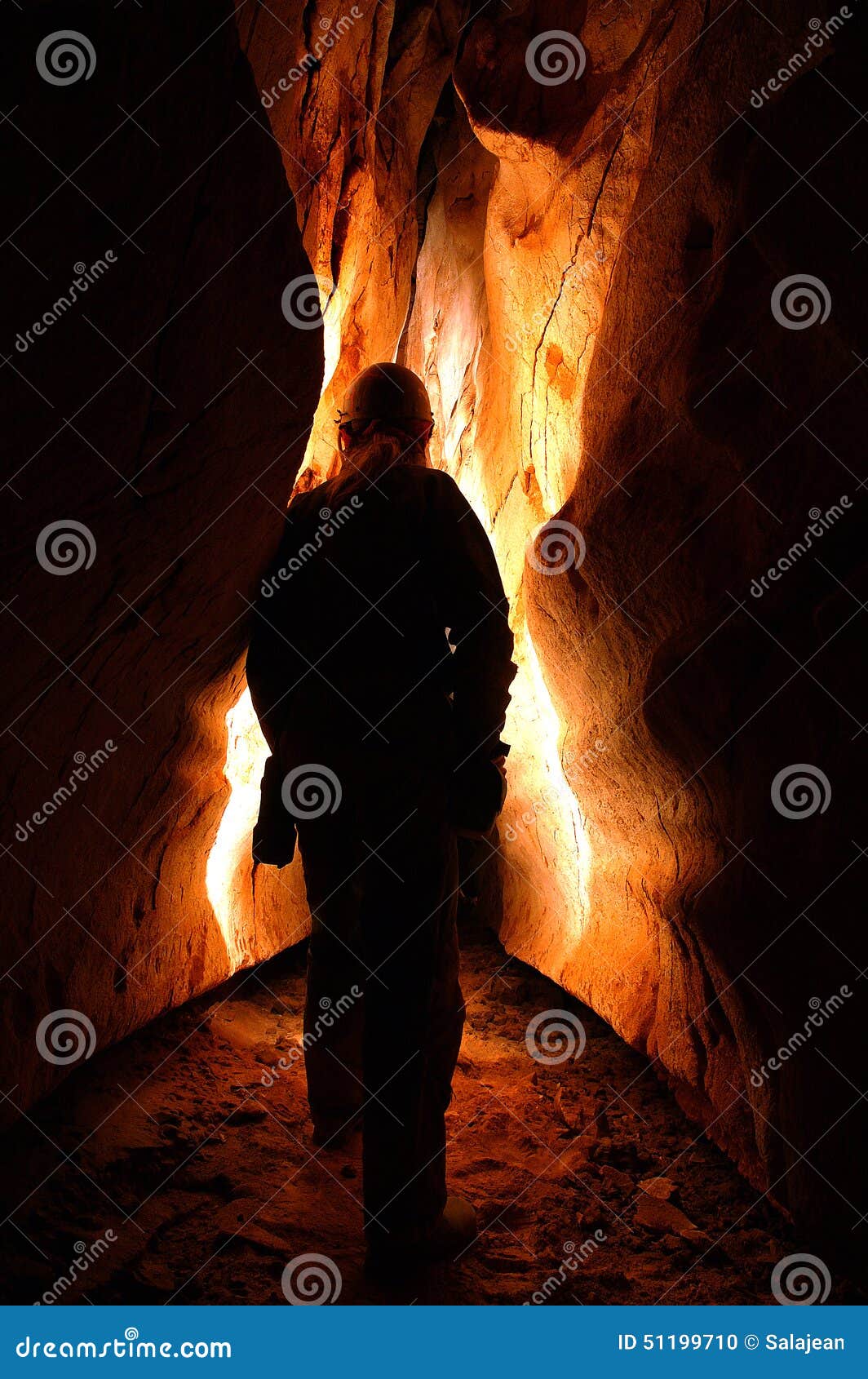 Spelunker exploring a cave stock photo. Image of geological - 51199710
