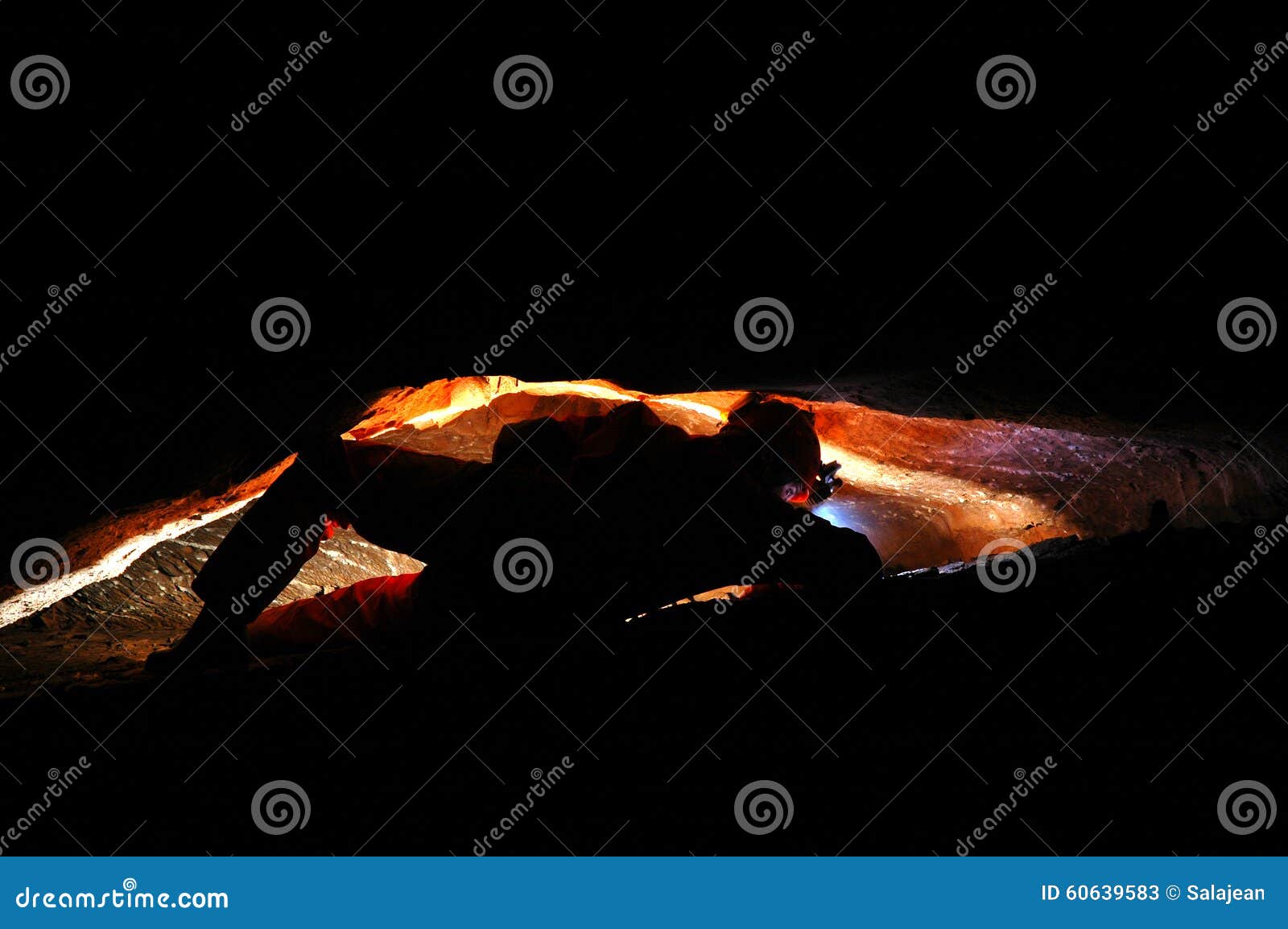 Narrow Cave Passage With A Cave Explorer Stock Photography ...