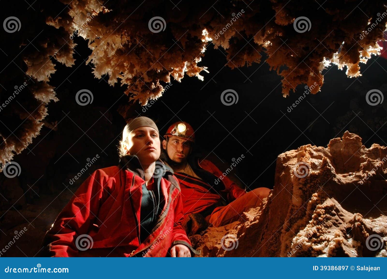 Spelunkers Admiring Stalactites in a Cave Stock Image - Image of ...