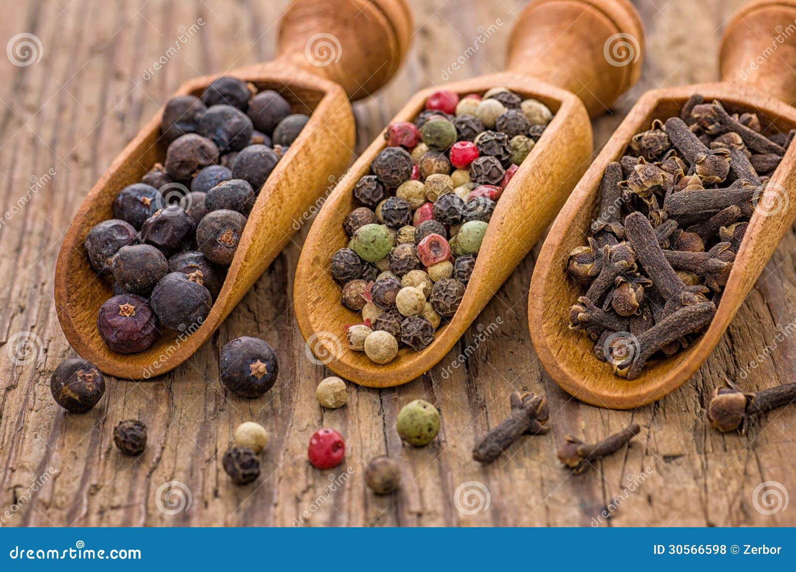 Spice Scoops with Juniper Berries Pepper and Cloves Stock Photo - Image ...