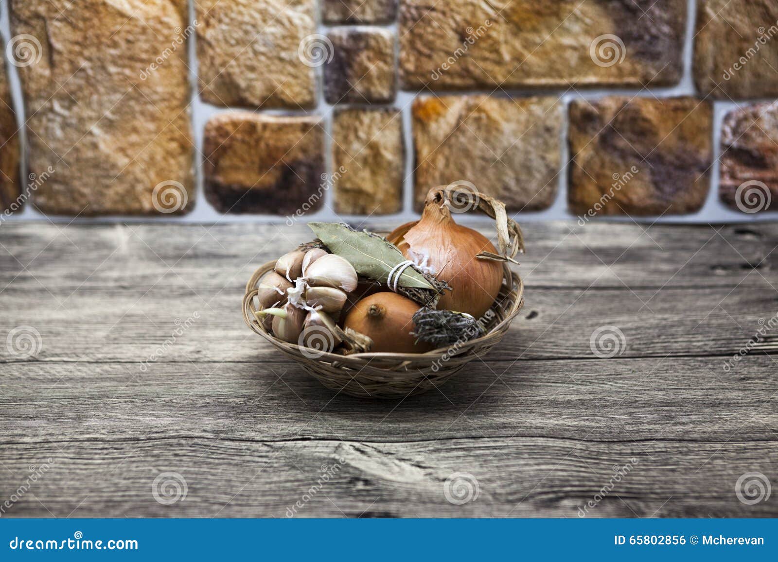 Spice Set in Wicker Basket Onion, Provence Herbs, Garlic at the Table ...