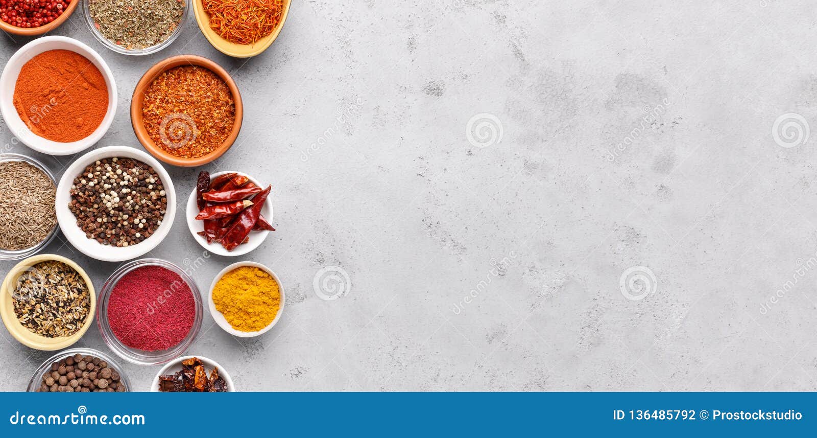 Spices and Condiments in Bowls on Grey Background Stock Photo - Image ...