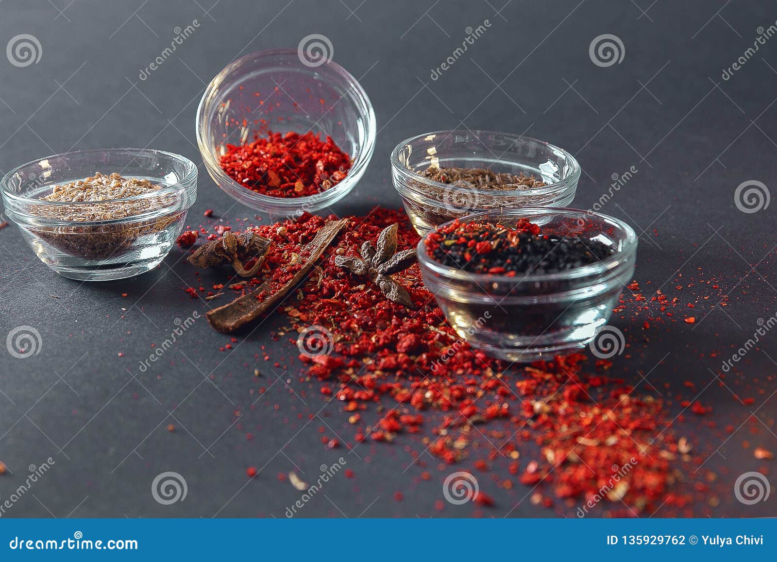 Spices Scattered on a Black Background Stock Photo - Image of cilantro ...