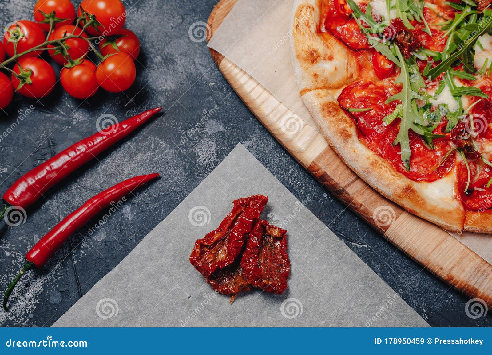 Spicy Appetizing Neapolitan Pizza on Board with Cherry Tomatoes and ...
