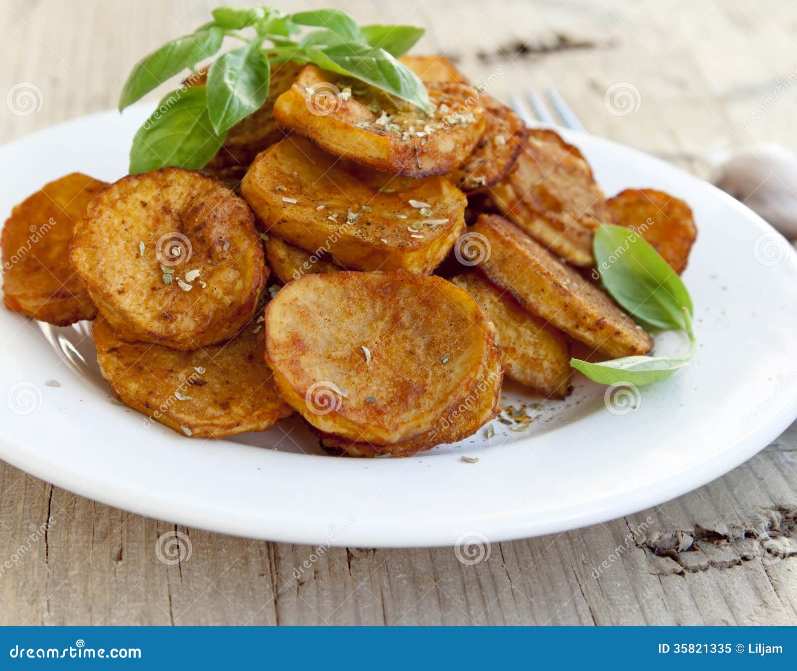 Spicy baked potatoes stock image. Image of fresh, basil - 35821335