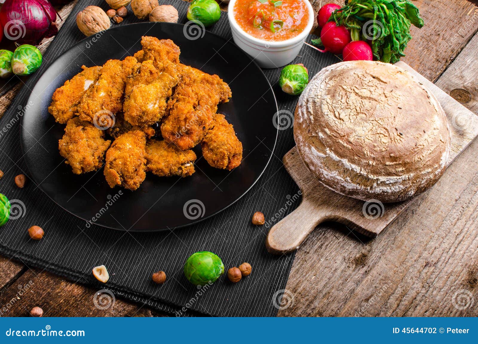 Spicy Breaded Chicken Wings with Homemade Bread Stock Photo - Image of ...