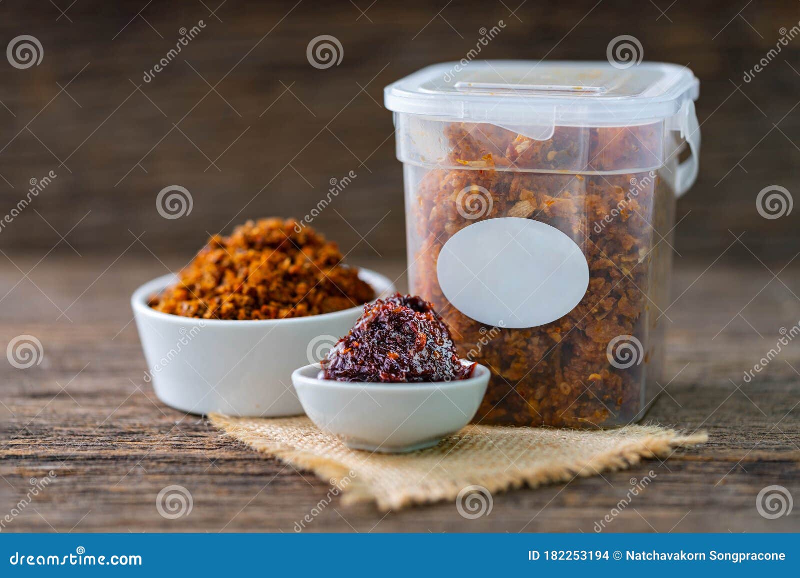 Spicy Chili Paste in White Ceramic and Plastic Containers on Wood ...